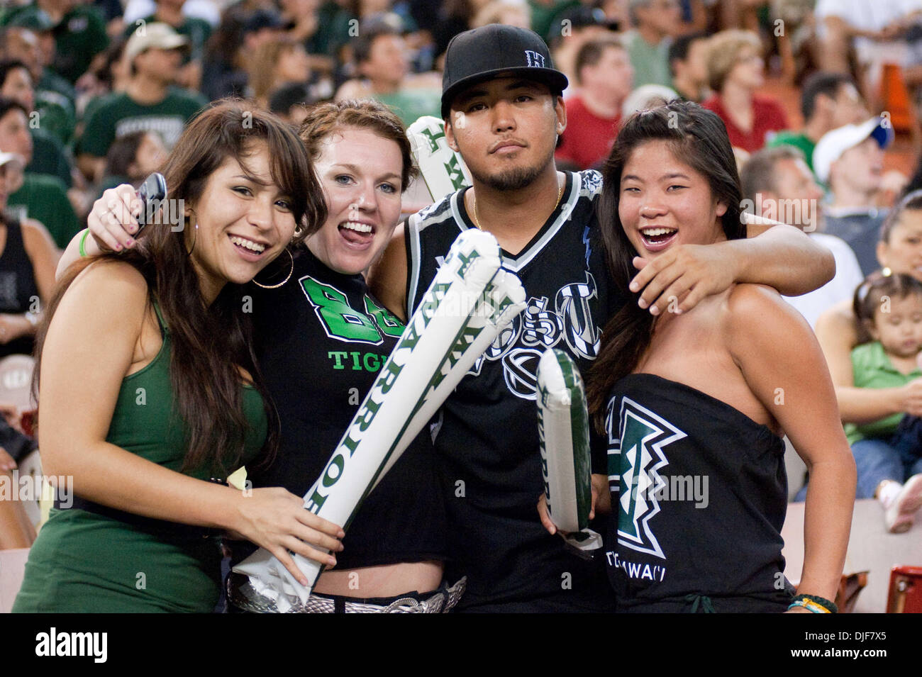 Hawaii fans pose during first half action in the game between the ...