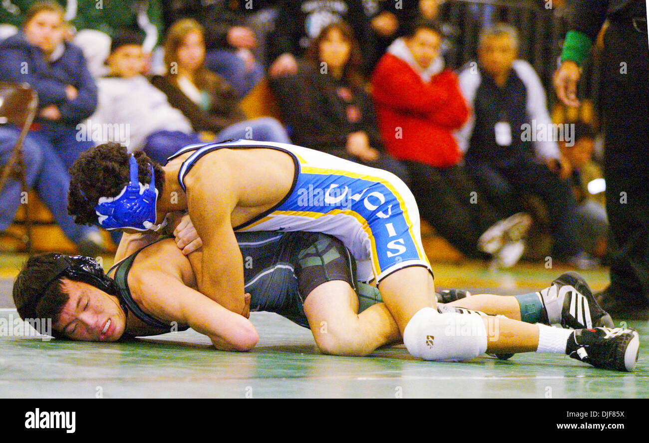 Mission's Ricky McFerrin (bottom) wrestles Clovis' Madison Gambrell ...