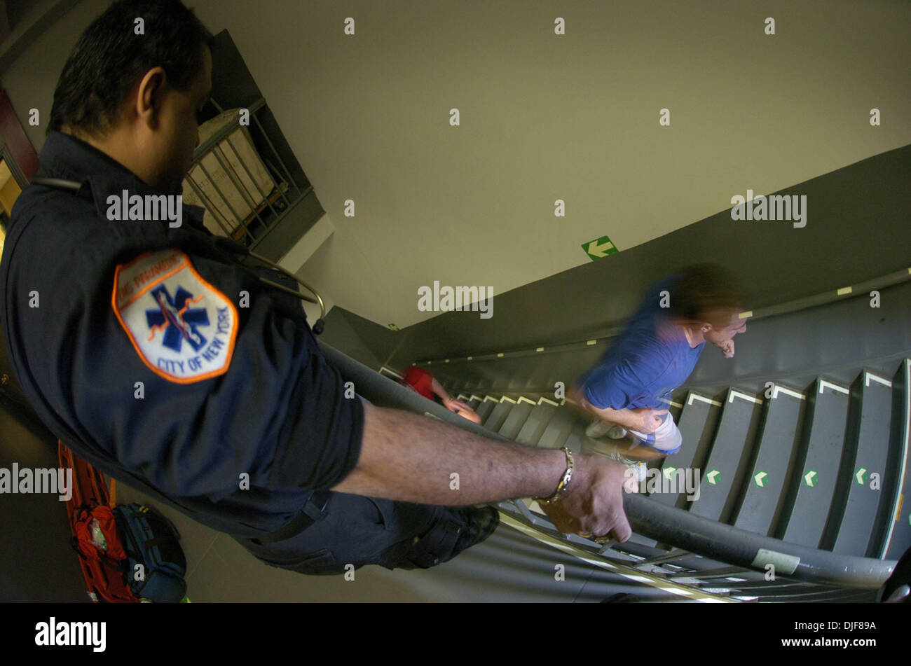 Feb 05, 2008 - Manhattan, NY, USA - A Paramedic looks on as runners ...