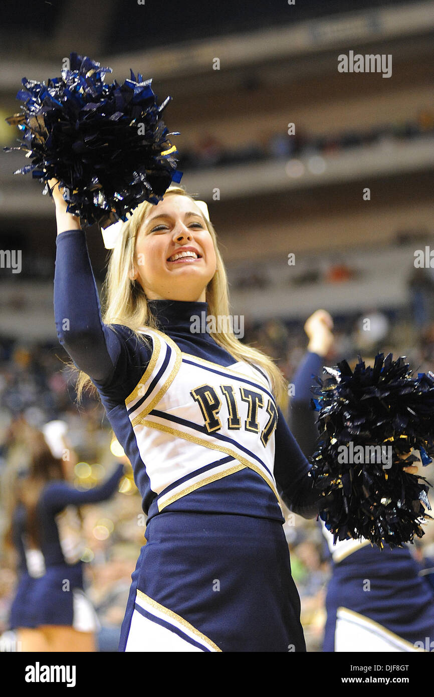 Pitt cheerleader tries to excite the crowd in first half action at the ...