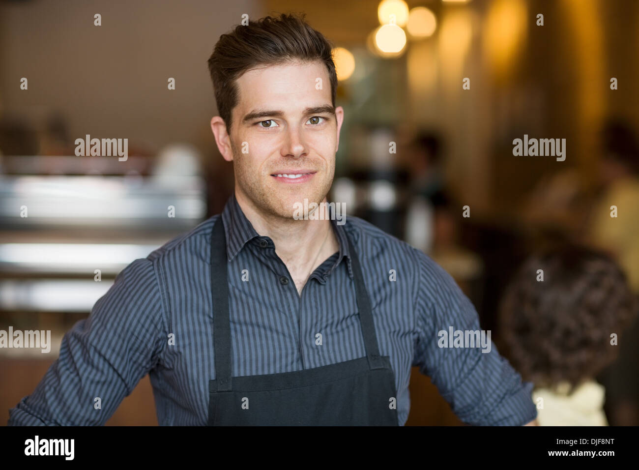 Smiling Male Owner In Cafe Stock Photo - Alamy