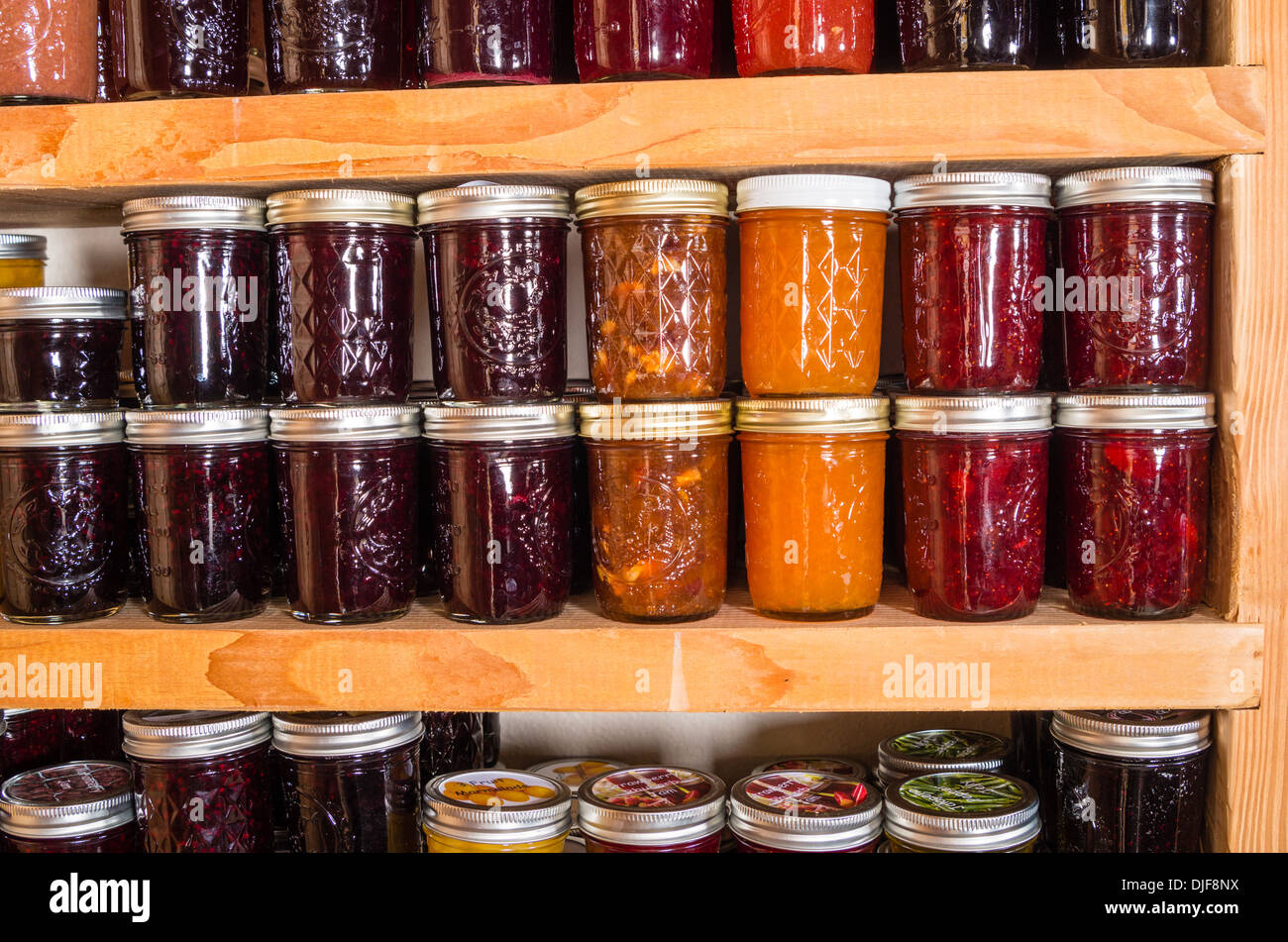 Canned goods on wooden storage shelves in pantry Stock Photo - Alamy