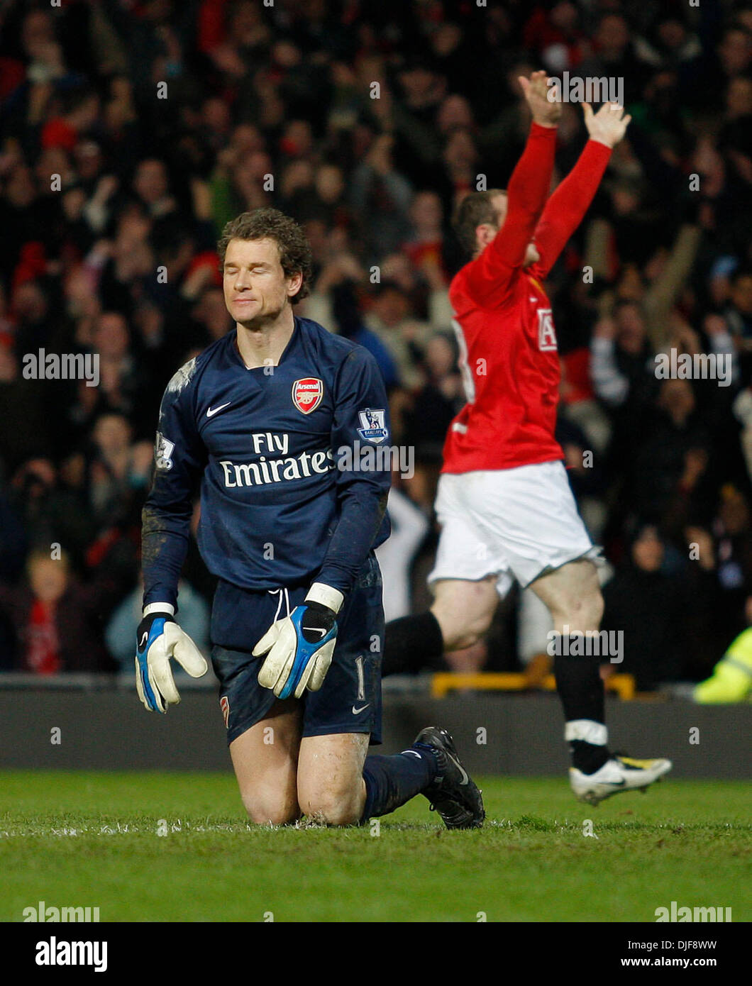 Jens Lehmann is left grounded while Wayne Rooney of Manchester United ...