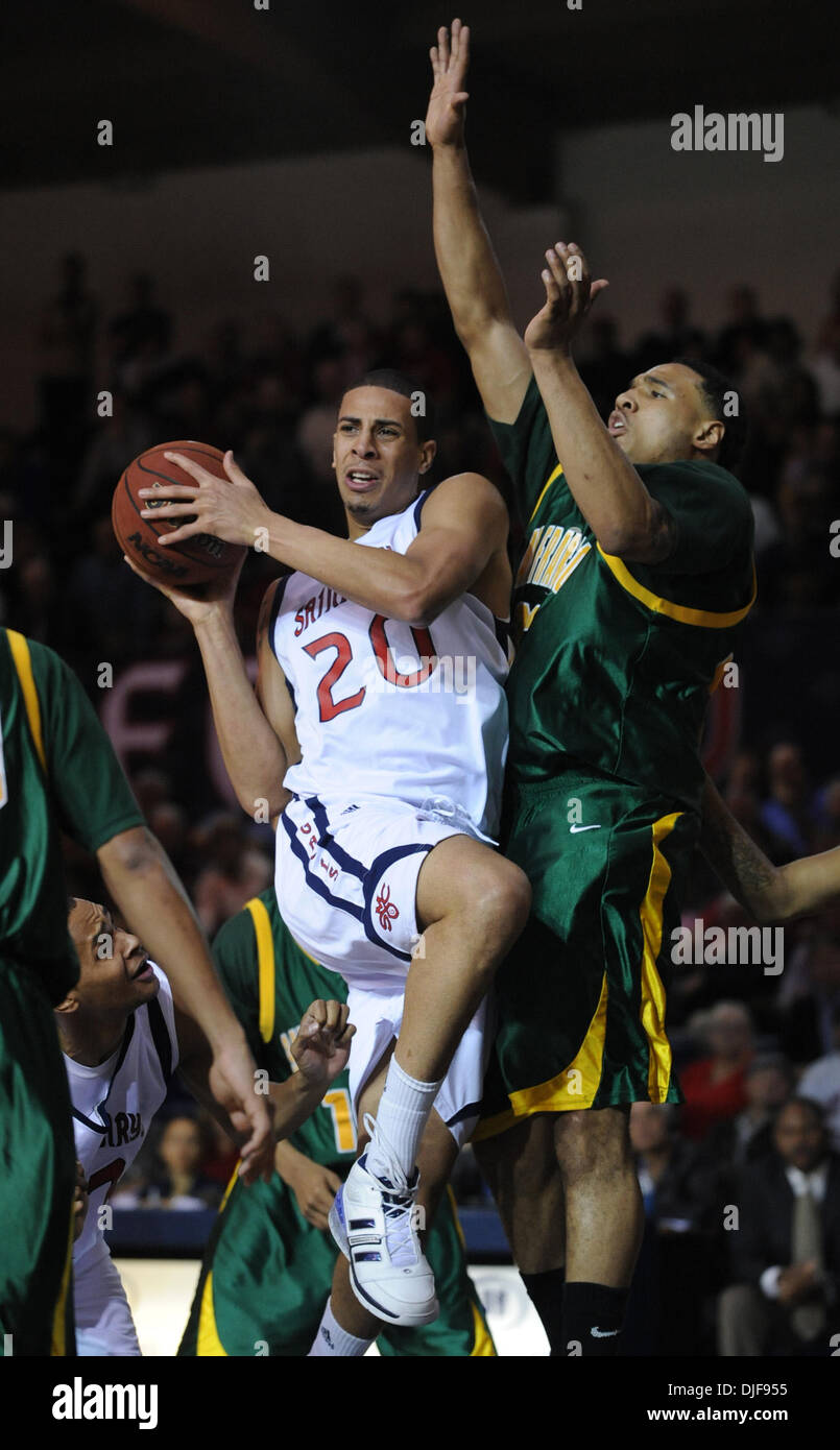 St. Mary's Gaels Diamon Simpson, #20, looks to pass as he drives ...