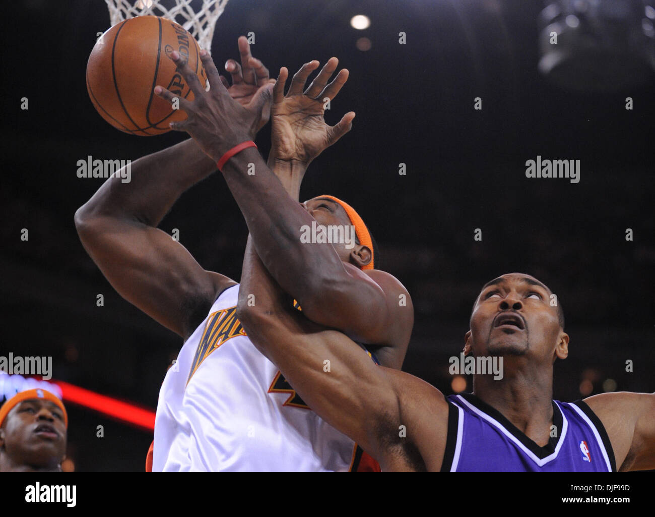 Golden State Warriors' Chris Webber, #4, gets tangled up with ...