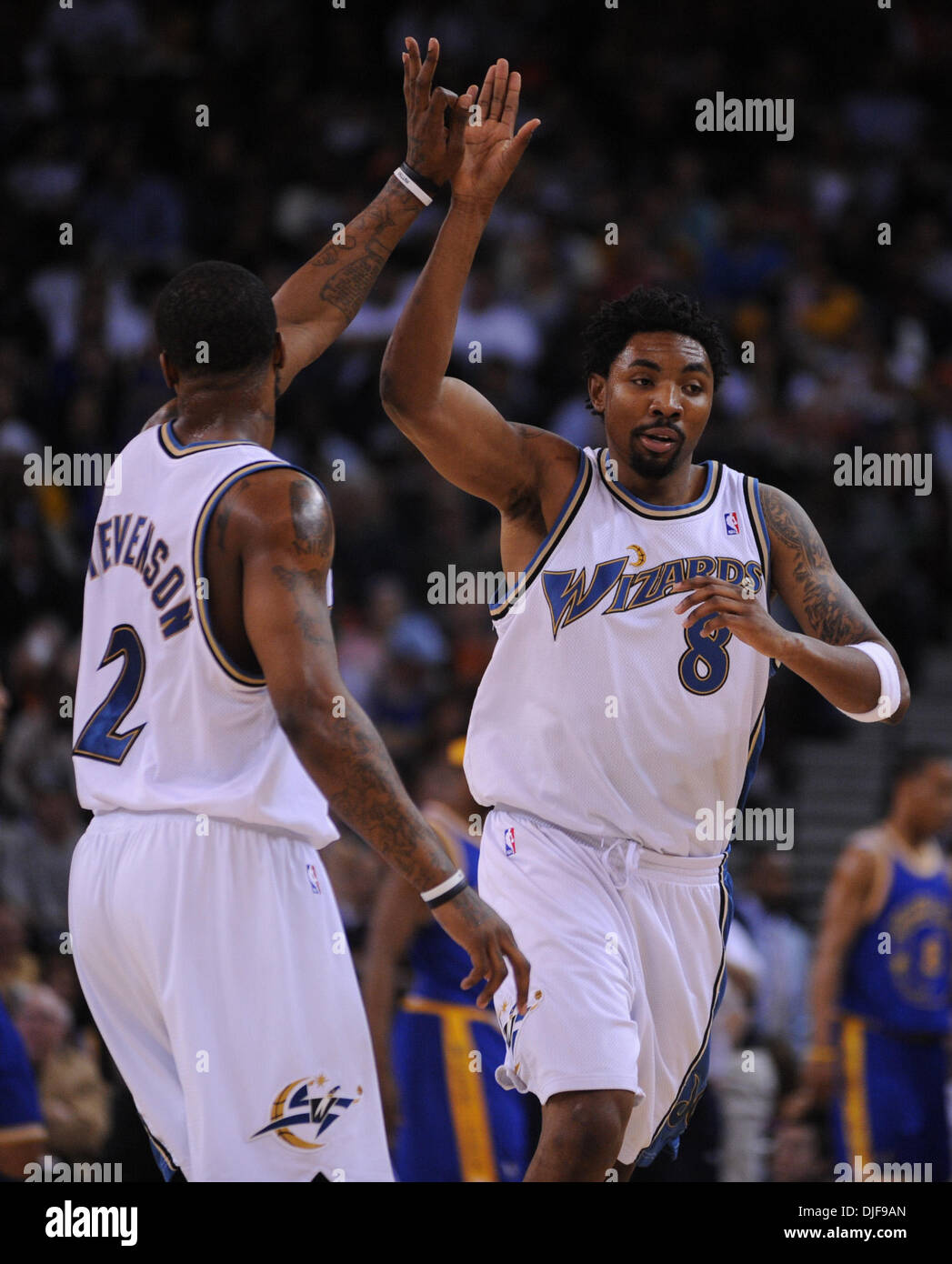Washington Wizards' Roger Mason, #8, hi-fives teammate DeShawn ...