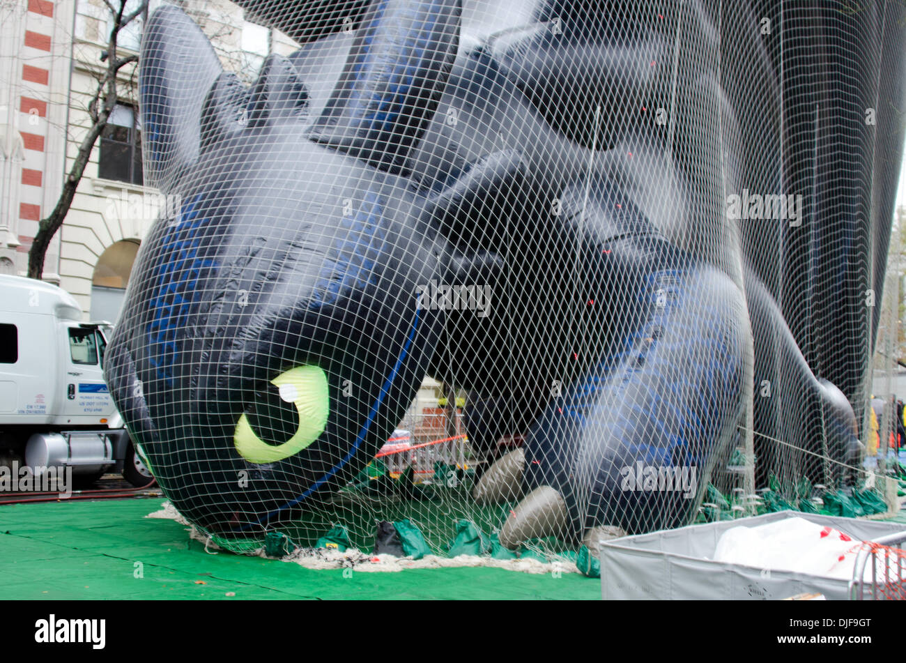 NEW YORK, NY, USA, Nov. 27, 2013. "Toothless" balloon being inflated on ...