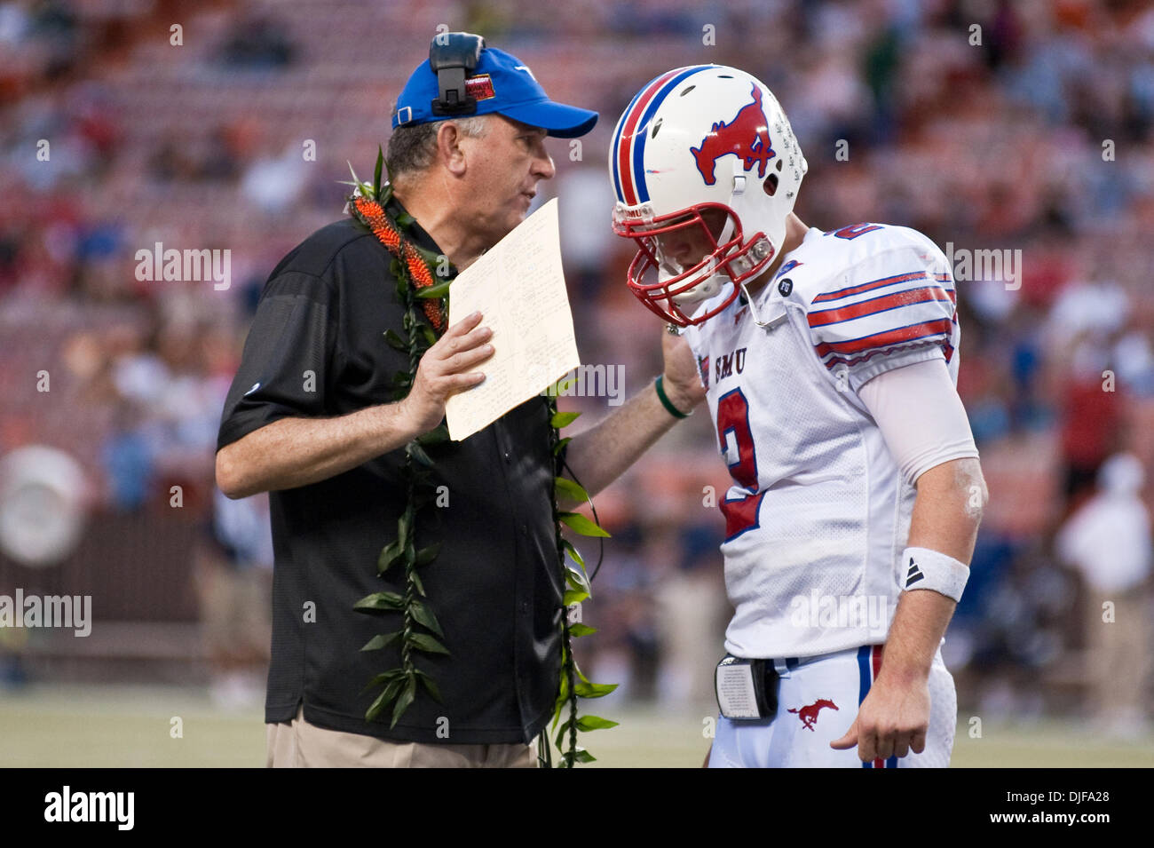 Coach June Jones give instructions to Southern Methodist quarterback ...