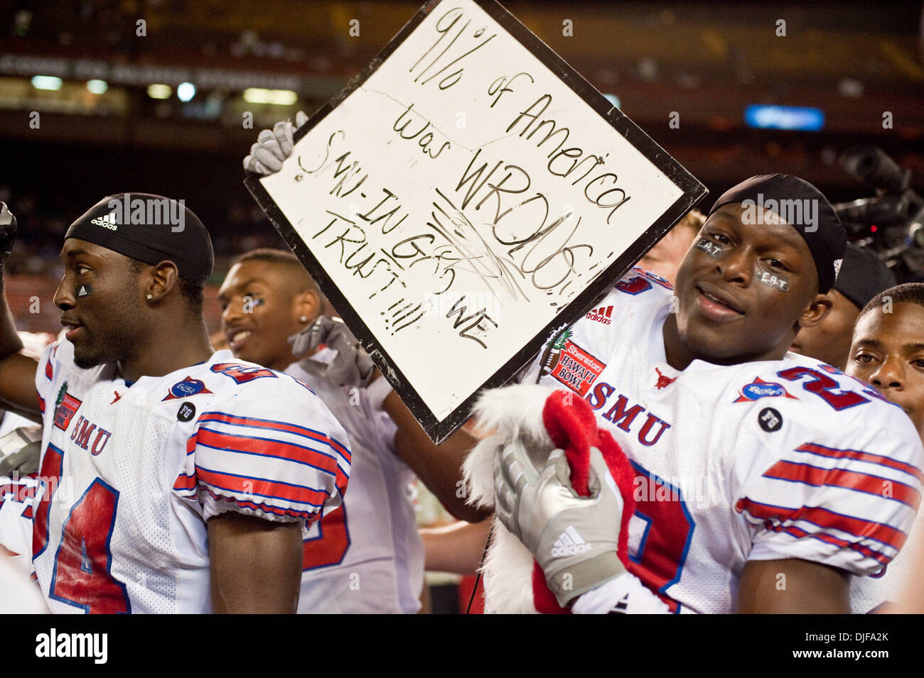 Southern Methodist cornerback Chris Banjo #23 displays a sign for the ...