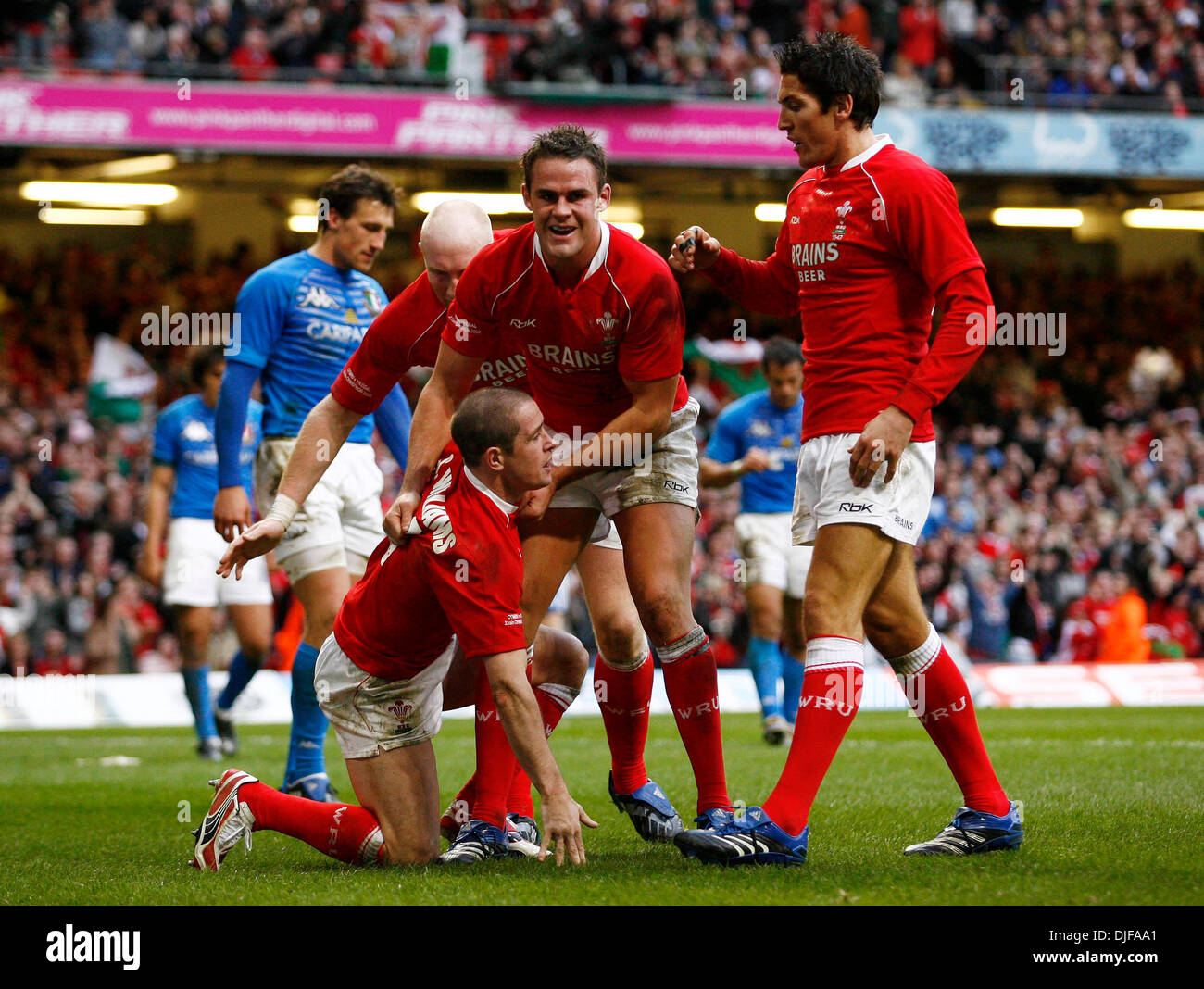 Shane Williams of Wales is congratulated after scoring his second try ...