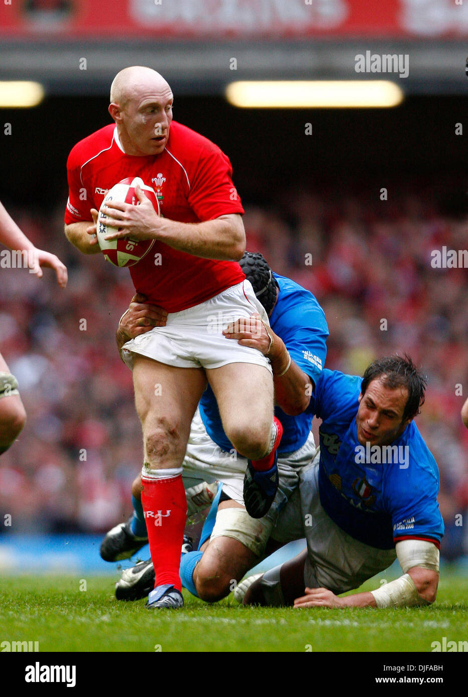 Tom Shanklin of Wales tackled by Sergio Parisse of Italy and Santiago ...
