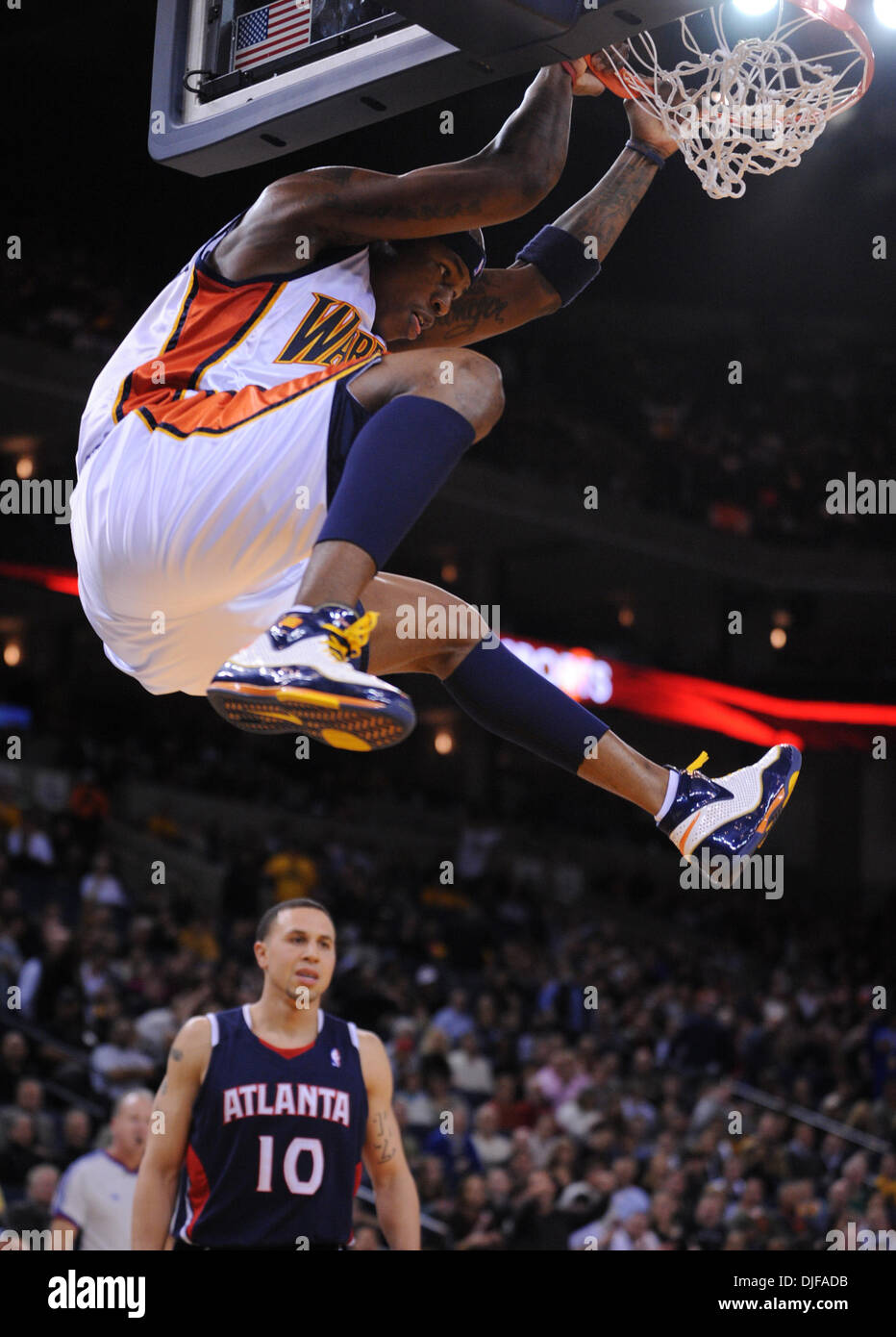 Golden State Warriors' Al Harrington, #3, hangs on the rim after ...