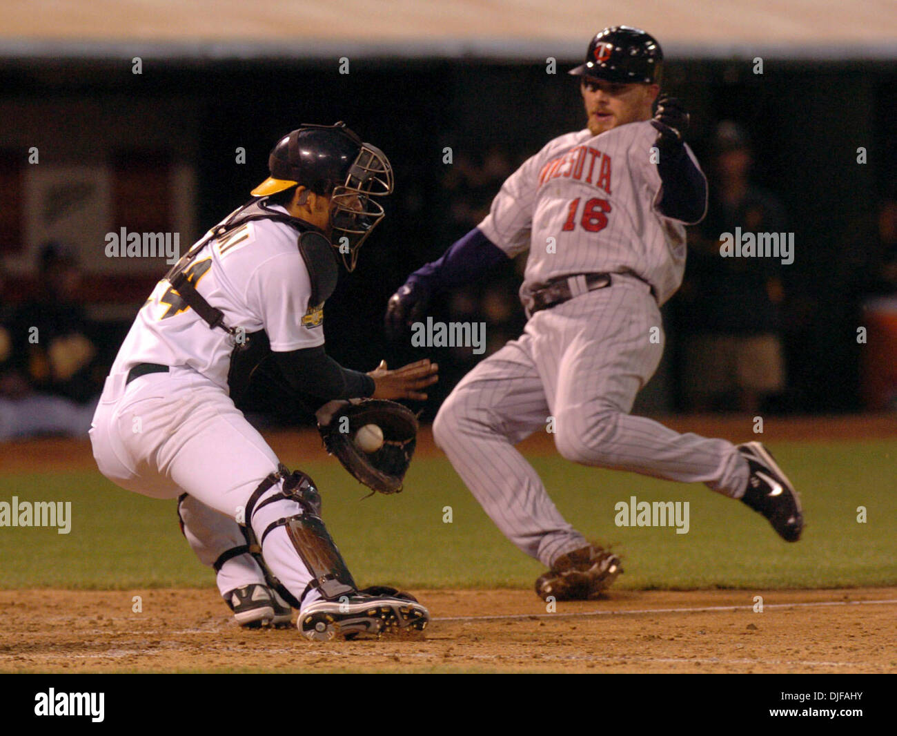 Minnesota Twins Jason Kubel slides safely into home as Oakland ...