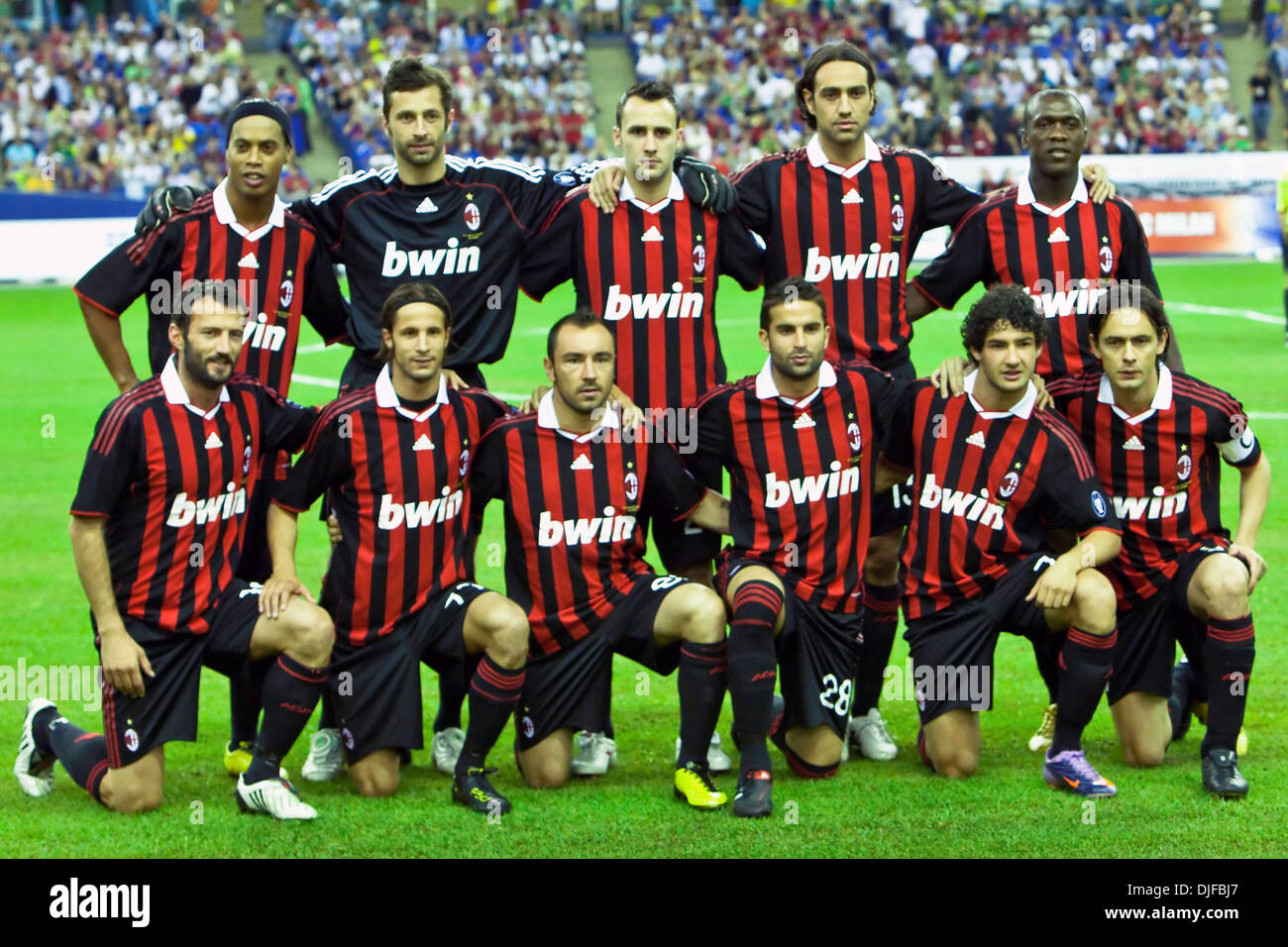 AC Milan team members pose for a picture before the start of a friendly ...
