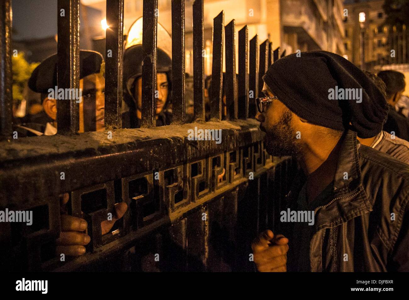 Cairo, Egypt. 27th Nov, 2013. Protesters argue with police officers ...