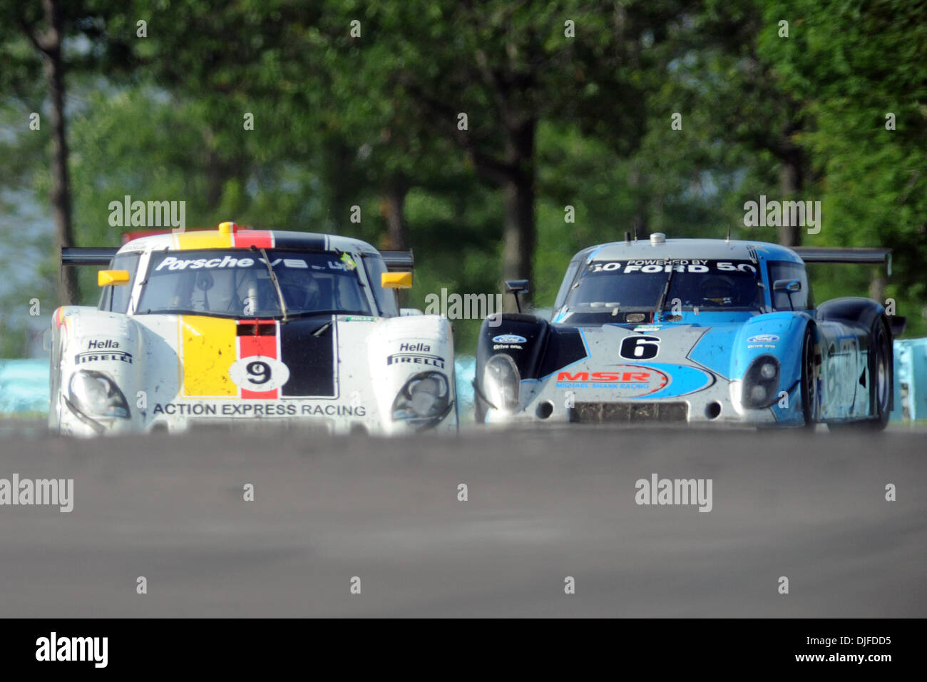 The Porsche Riley of Action Express Racing (9) leads the Ford Riley of ...