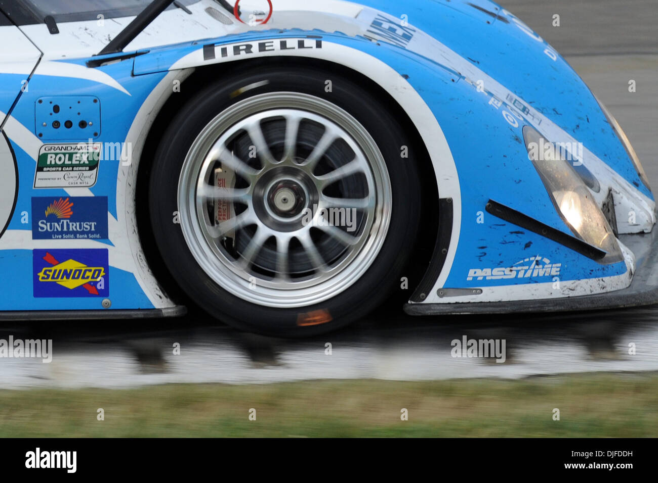 The front right wheel of the Chip Ganassi Racing BMW Riley runs over ...
