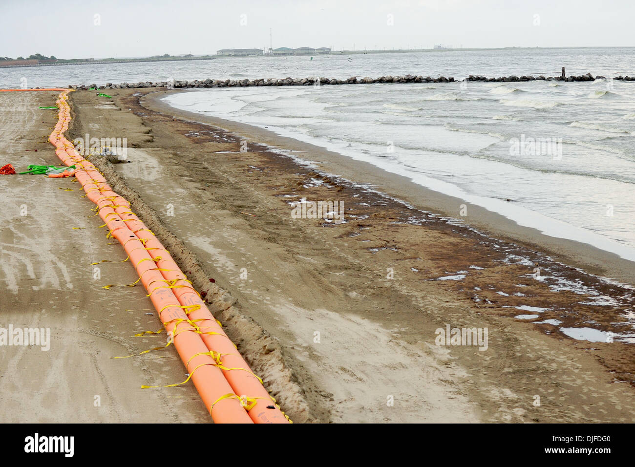 Miles of protective oil booms line Grand Isle beach as oil washes ...
