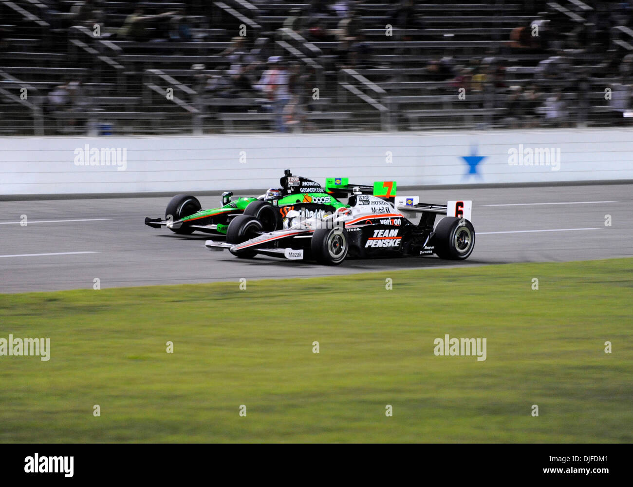 Ryan Briscoe of Team Penske and Danica Patrick of Andretti Autosport ...
