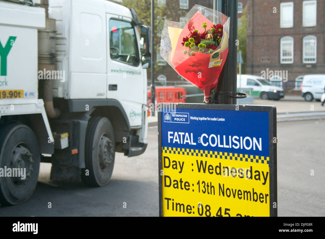 Police sign, flowers and traffic at Bow flyover, London Stock Photo - Alamy