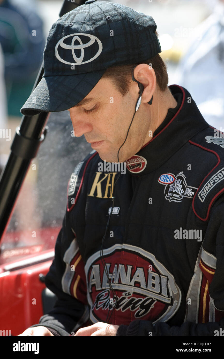NHRA Top Fuel dragster driver Larry Dixon listens to music prior to the ...