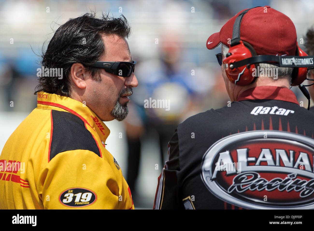 Two crew members chat in between rounds of the NHRA Route 66 Nationals ...
