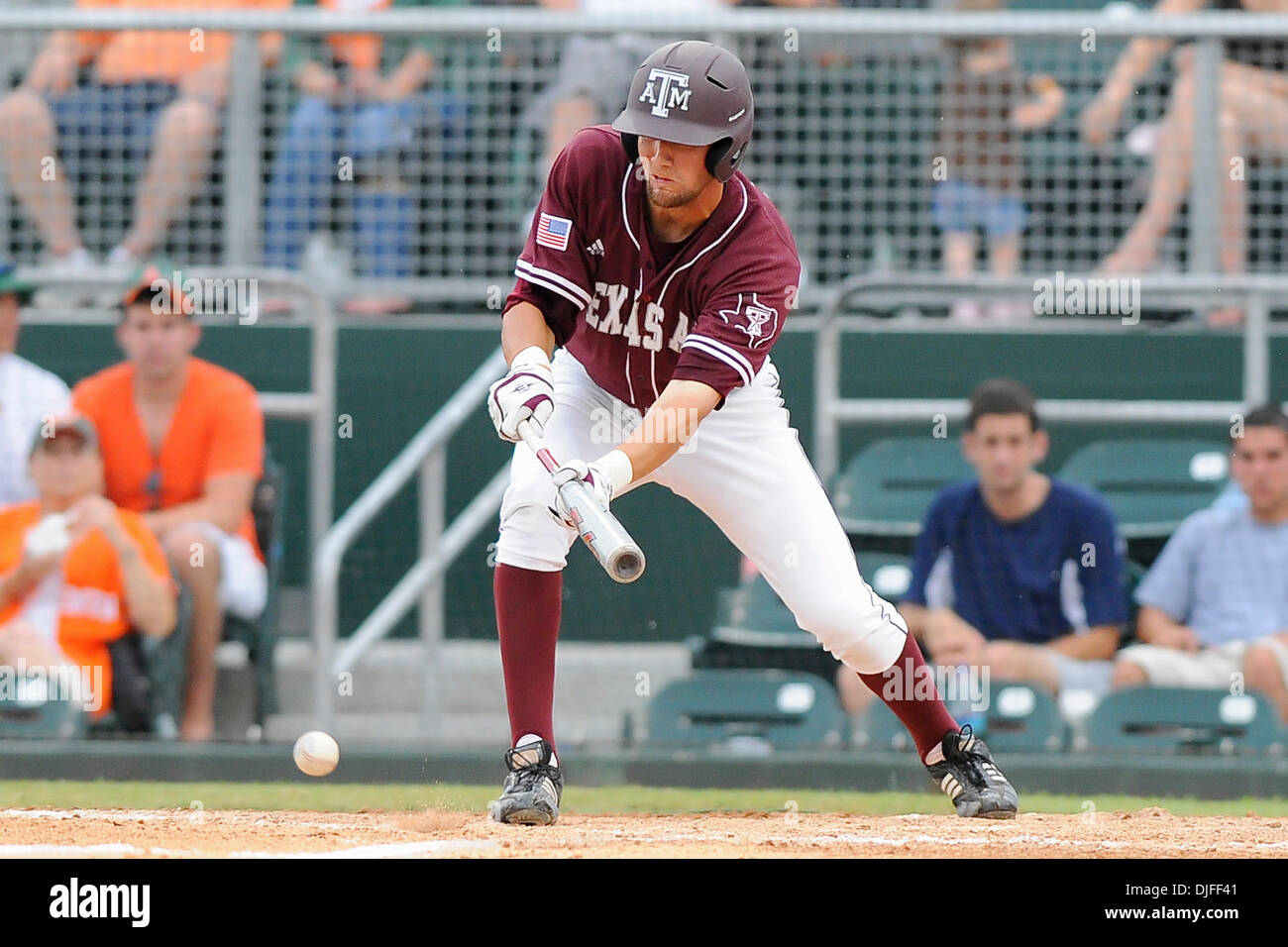 Texas A & M Aggies INF Kenny Jackson (5) lays down a perfect bunt. The ...