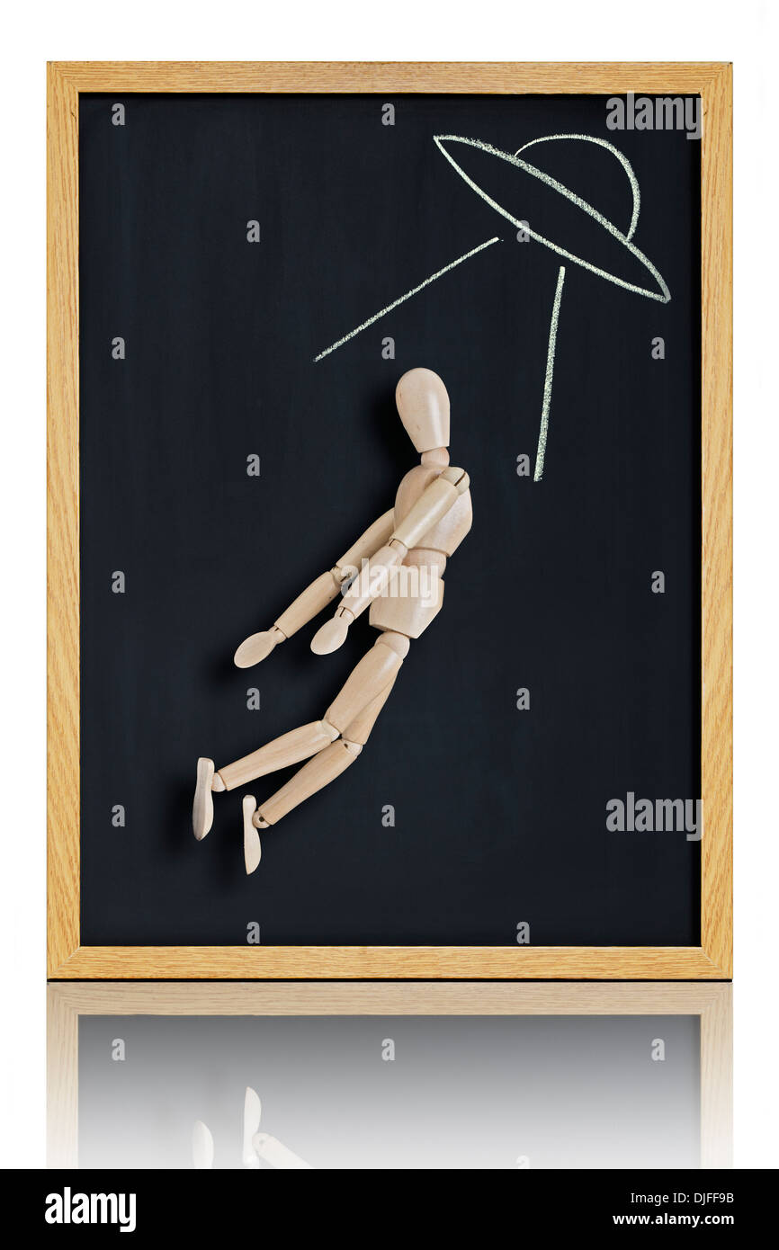 Beam me up. Manikin, anatomical model, placed on a chalkboard with an ...