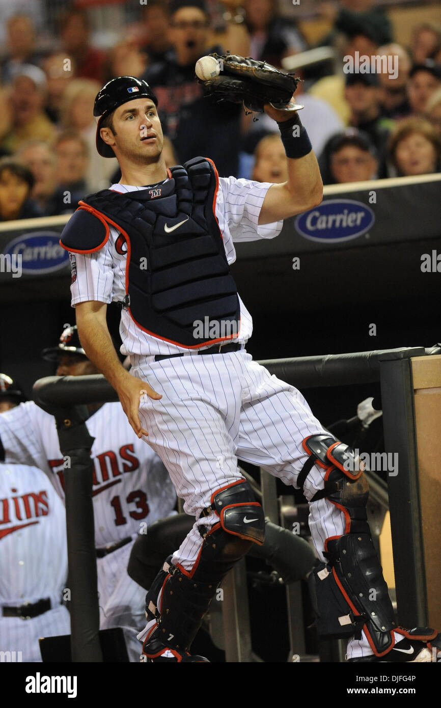Minnesota Twins catcher Joe Mauer #7 shows the foul ball he caught in ...