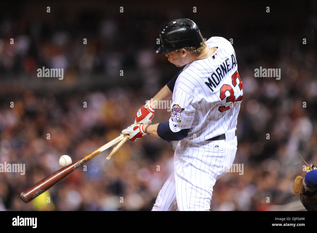 Minnesota Twins first baseman Justin Morneau #33 breaks his bat on a ...