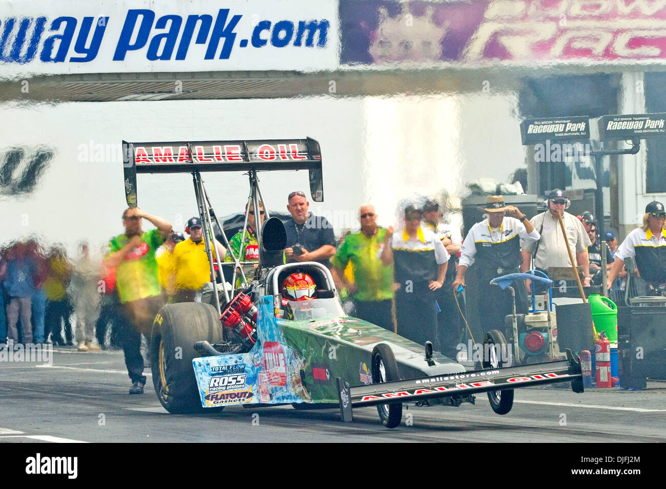Terry McMillen in the Amalle Oil dragster, has his front wheels lift ...