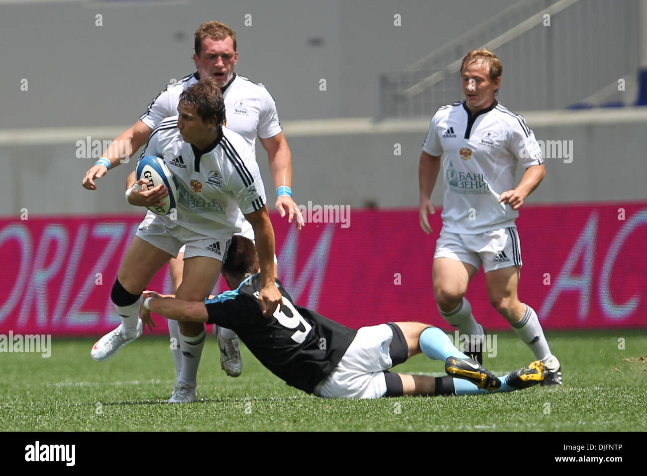 Uruguay Scrumhalf Manuel Martinez (#9) grabs for the Russian ball ...