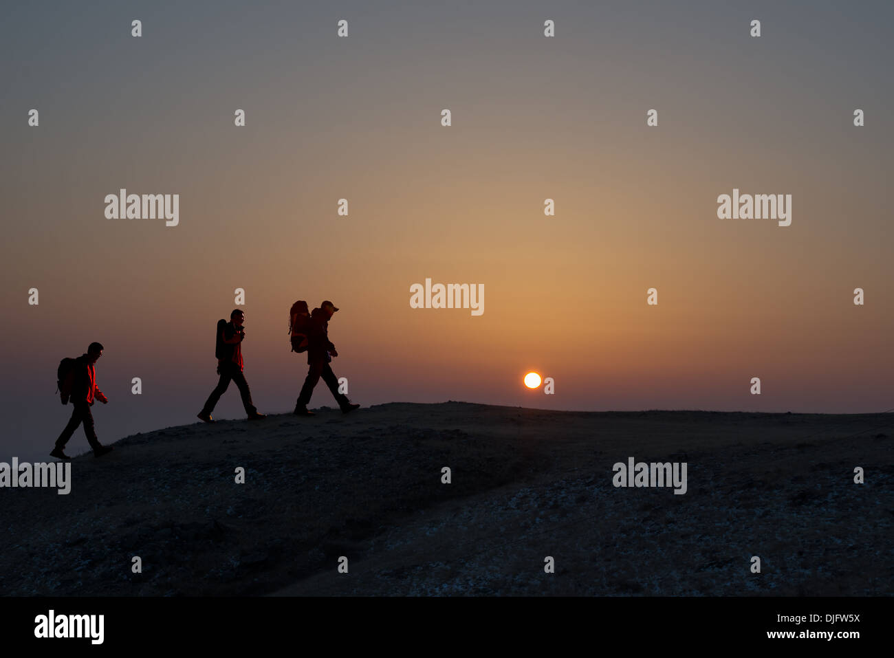 Trekking in mountains, greet the morning sun Stock Photo - Alamy