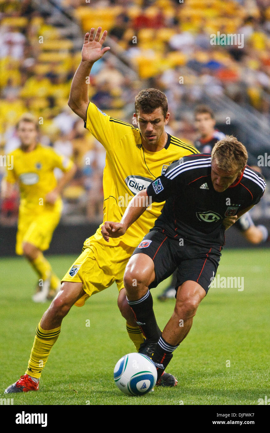 Crew defender Eric Brunner (23) and United forward Adam Cristman (7 ...