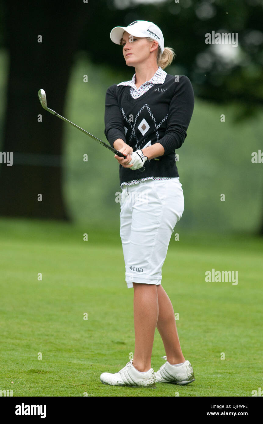 Golfer Sarah Jane Smith hits a pitching wedge to the 8th green during ...