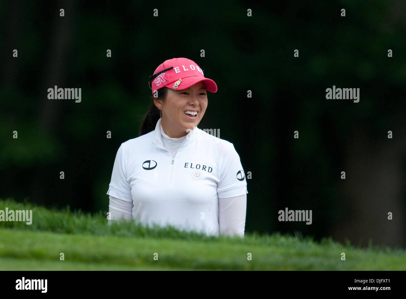 Golfer M.J. Hur like the result of her bunker shot at the 5th green ...