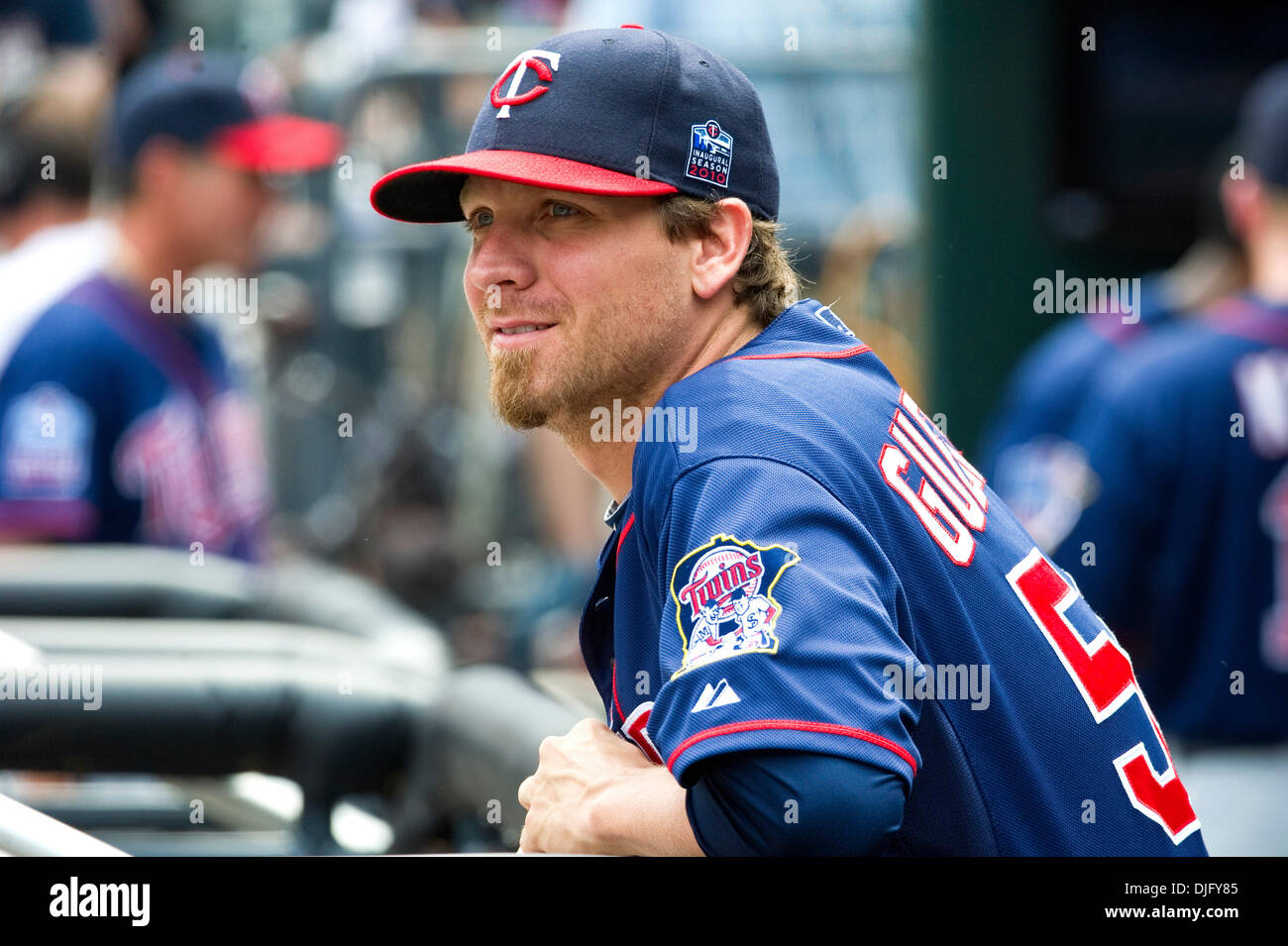 Twins pitcher Matt Guerrier #54 watches the game from the dugout ...