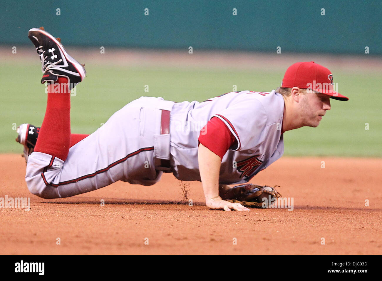 St. Louis Cardinals shortstop Tyler Greene (27) braces himself after ...