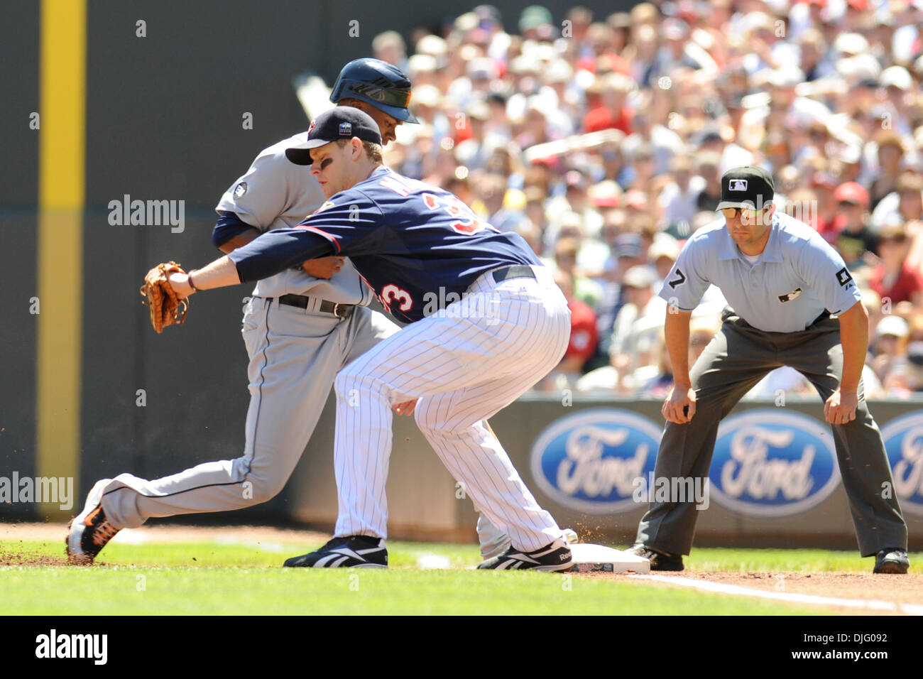 Minnesota Twins first baseman Justin Morneau #33 catching a throw from ...