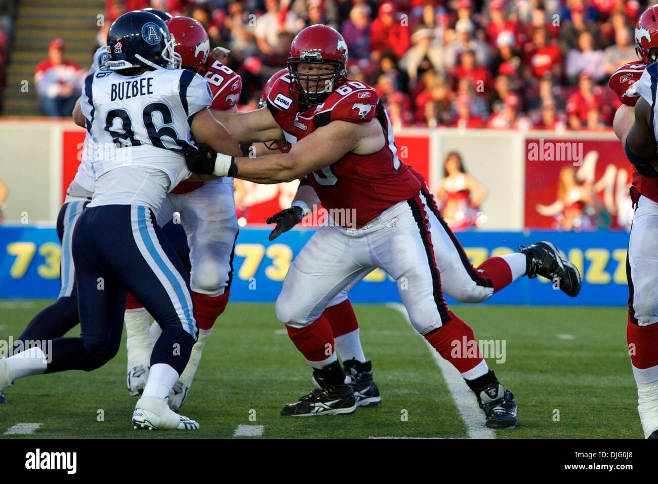 Calgary Stampeders offensive lineman Dan Comiskey (60) blocks Toronto ...