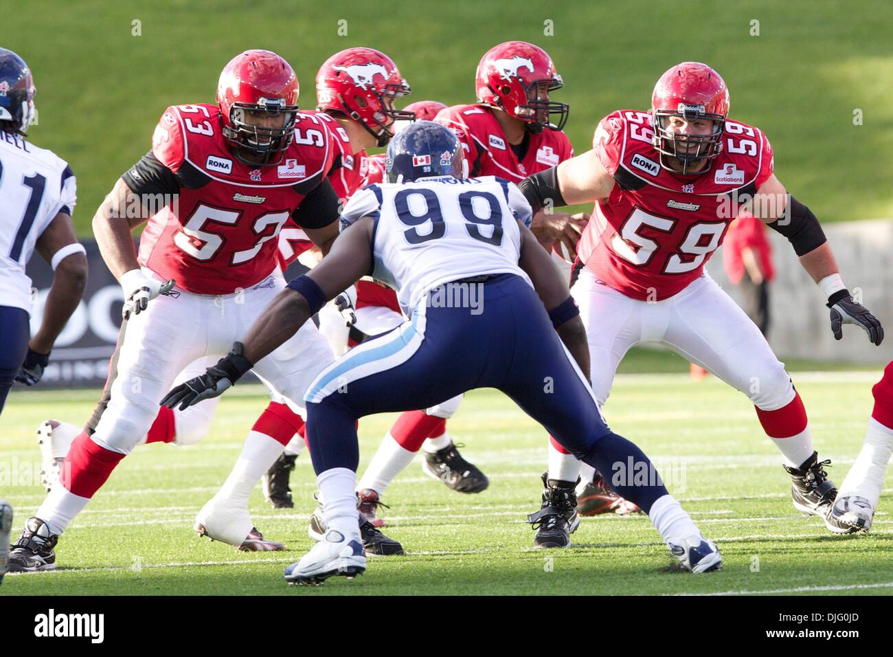 Toronto Argonauts defensive end Ronald Flemons (99) tries to get by ...