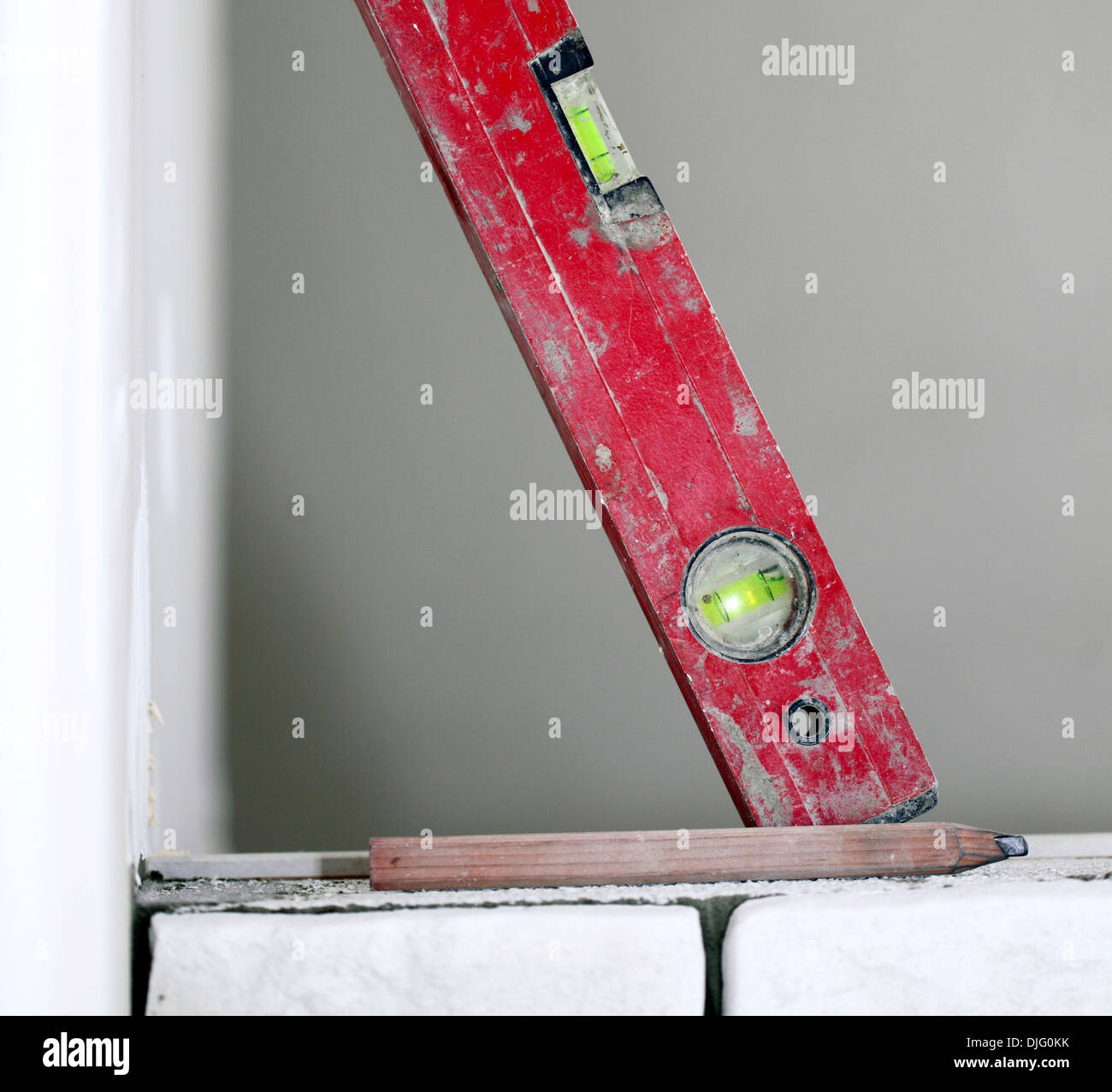 Red balance spirit building level in construction site Stock Photo - Alamy
