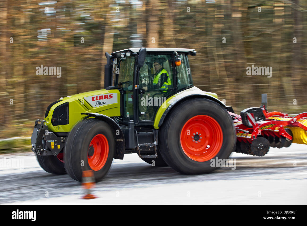 A farmer drives his tractor during a safe driving training for farmers ...