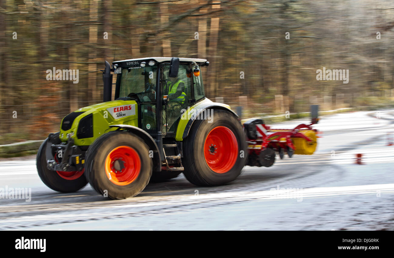A farmer drives his tractor during a safe driving training for farmers ...