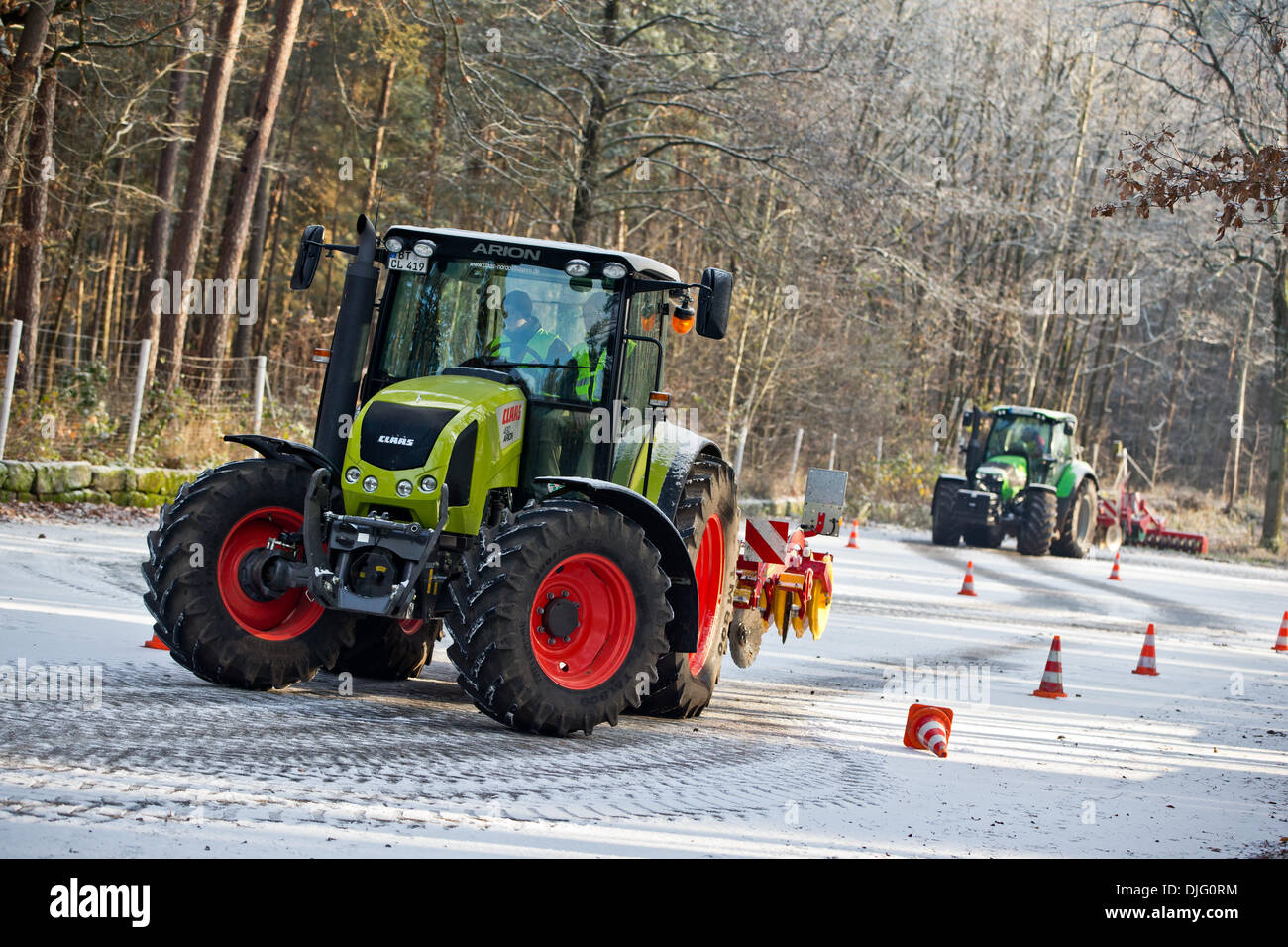 A farmer drives his tractor during a safe driving training for farmers ...