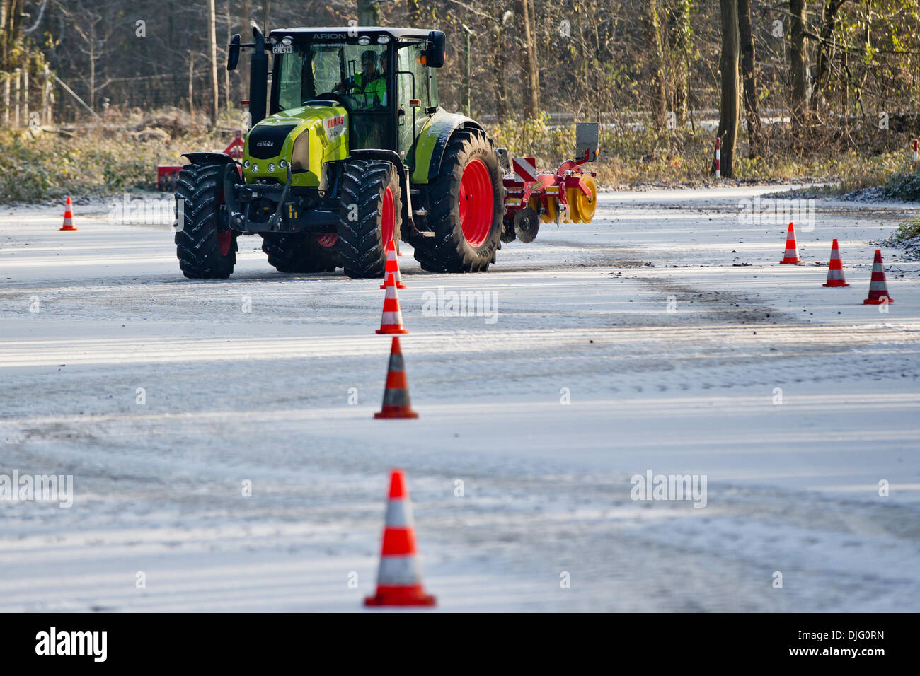 A farmer drives his tractor during a safe driving training for farmers ...