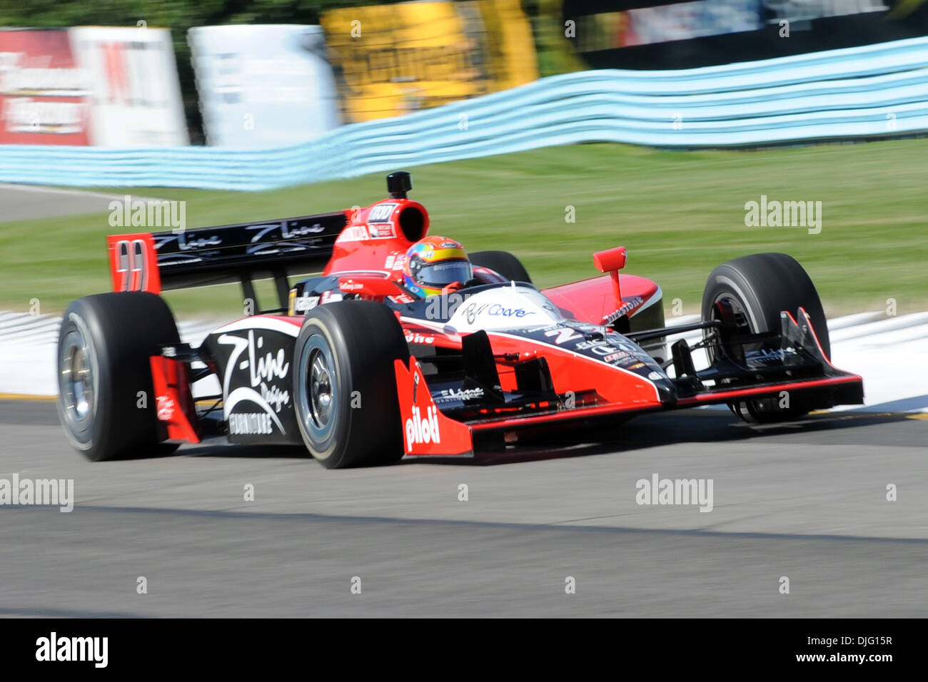 Dreyer & Reinbold Racing's Justin Wilson rides the rumble strip in turn ...
