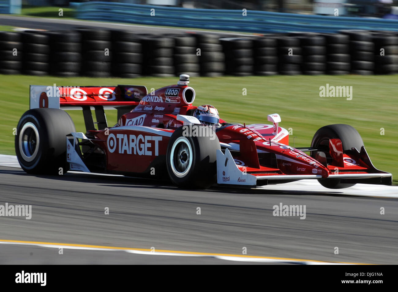 The Target Chip Ganassi Honda driven by Scott Dixon speeds through turn ...