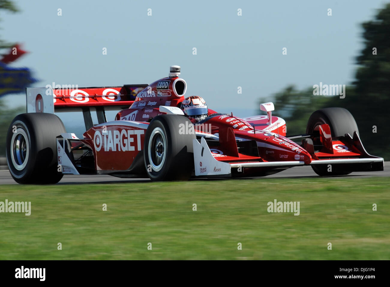 Target Chip Ganassi driver Scott Dixon powers out of the bus stop and ...