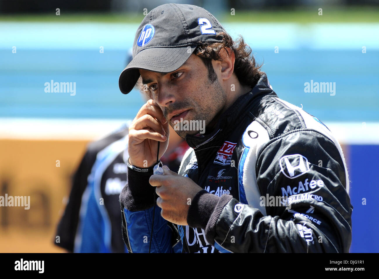 Brazilian driver Raphael Matos puts in his ear phones before climbing ...